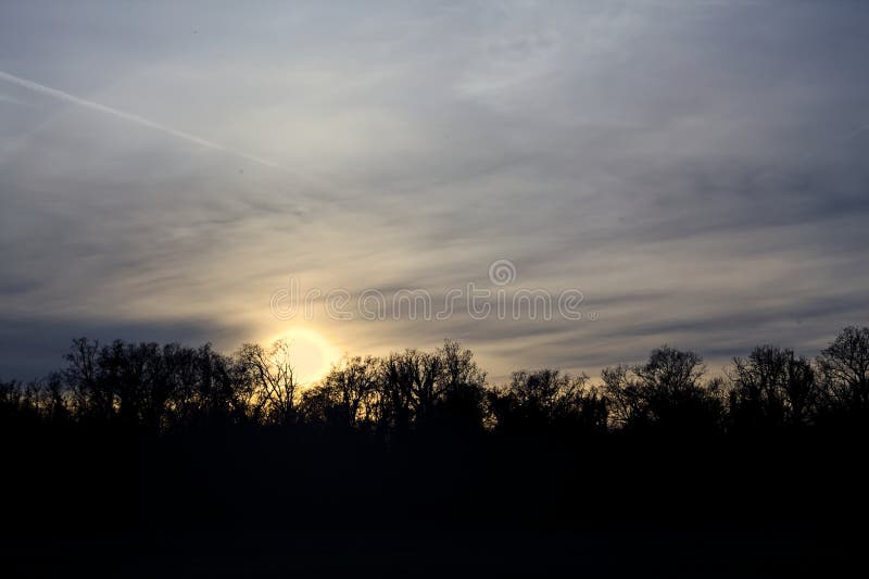 Overcast Sunset Sky with Silhouette of a Park Stock Photo - Image of ...