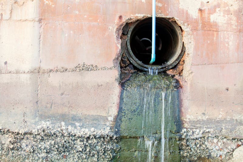 Overflow Water Pipe. Stone Wall Background Stock Photo - Image of pipe ...