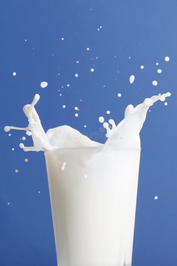 Overflowing milk in glass stock image. Image of refreshment - 9471559