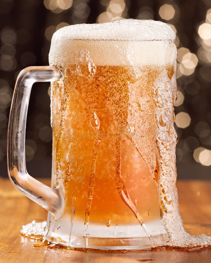 Overflowing mug of beer stock image. Image of glass, froth - 20178929