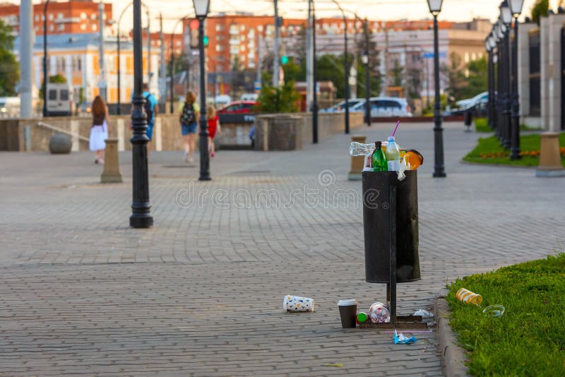 Overflowing Trash Can on the Sidewalk Pavement at Summer Daylight Stock ...