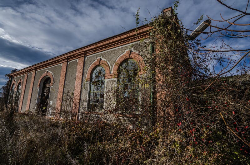 Overgrown Building with Bricks Stock Photo - Image of overgrown, danger ...