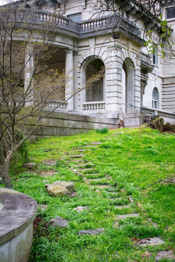 An Overgrown Stone Path Leading Up To a Mansion Stock Photo - Image of ...