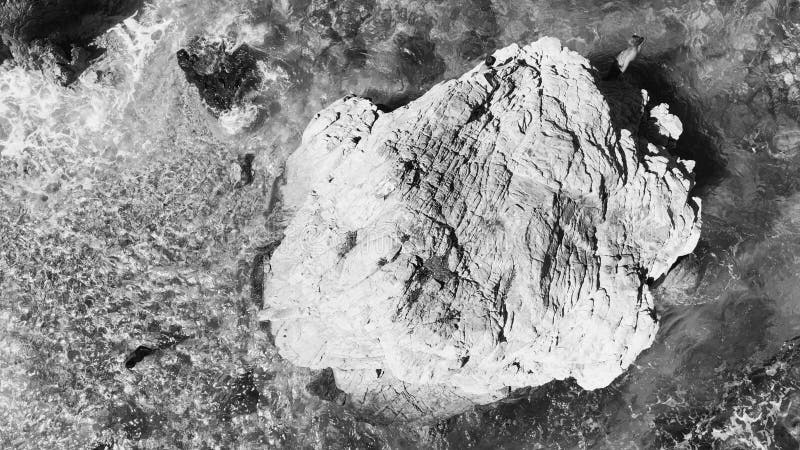 Overhead Aerial View of Rock Over the Ocean Water. Slow Motion Stock ...