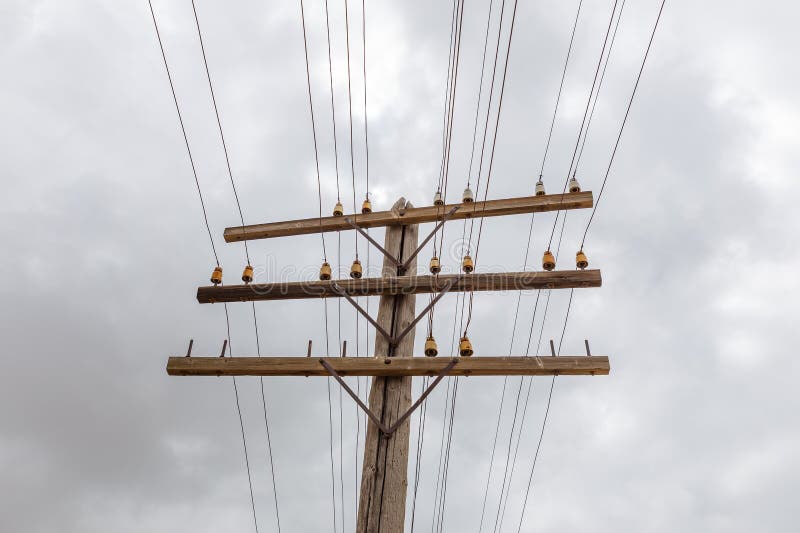 Overhead Communication Line Connected To Wooden Utility Pole Against a ...
