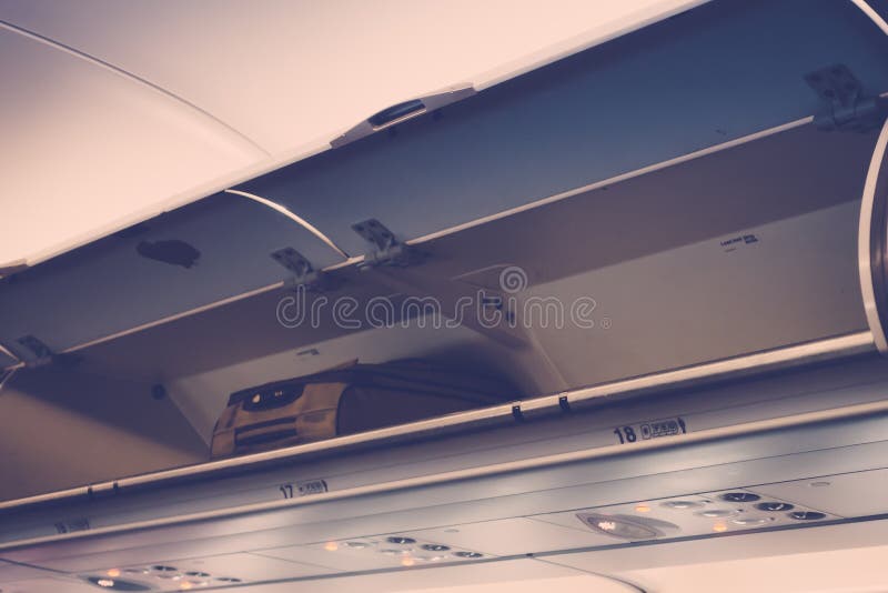 Overhead Compartment in Commercial Airplane .( Filtered Image Pr Stock ...