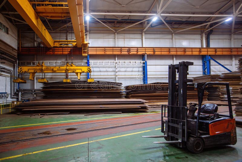 Overhead Crane with Electromagnetic Beam Grippers Loading Steel Sheets ...