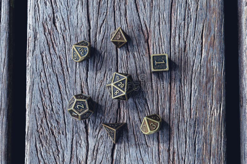Overhead Image of a Set of Metallic Dice on a Wooden Surface Stock ...