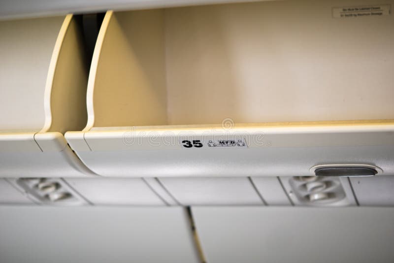 Overhead Luggage Compartment of Airplane Stock Photo - Image of flight ...