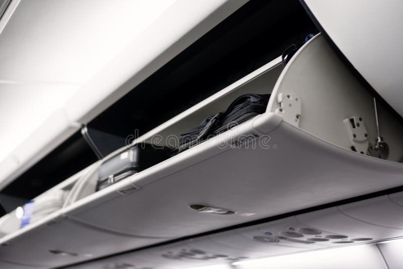Overhead Luggage Compartment on Airplane Stock Image - Image of ...