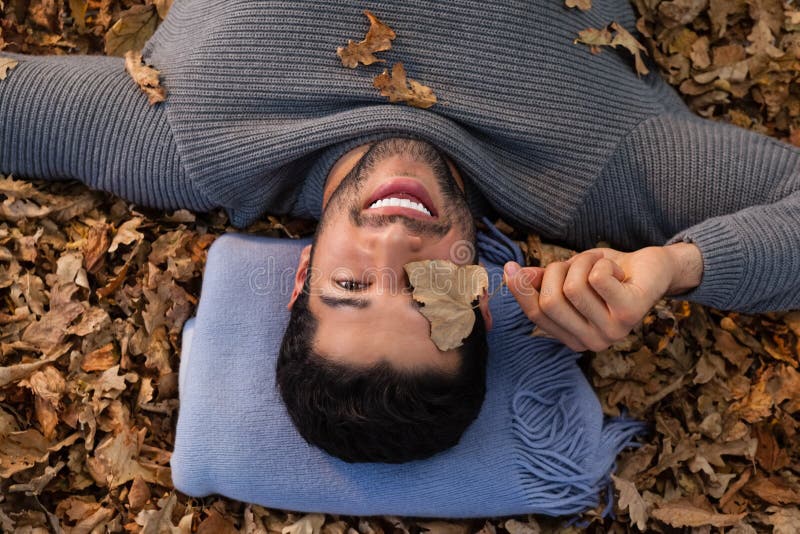 Overhead of Man Lying on Autumn Leaves Stock Photo - Image of fallen ...
