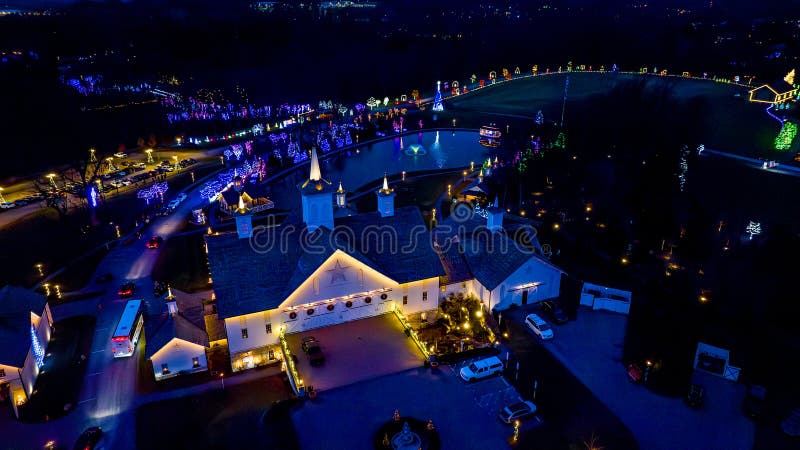 Overhead Night View of a Complex with Buildings Outlined in Lights, a ...