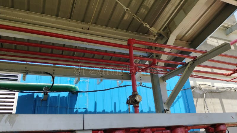 Overhead Red Pipeline System in an Industrial Setting Stock Photo ...
