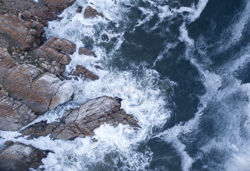Overhead Sea and Rocky Coastline Stock Photo - Image of water, waves ...