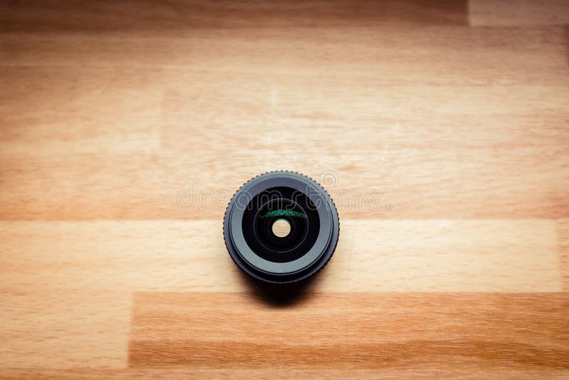 Overhead Shot of a Black Camera Lens on the Wooden Surface Stock Image ...