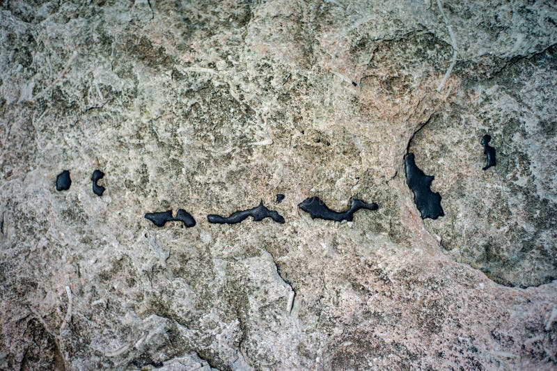 Overhead Shot of Black Traces Left on the Rock Surface Stock Image ...