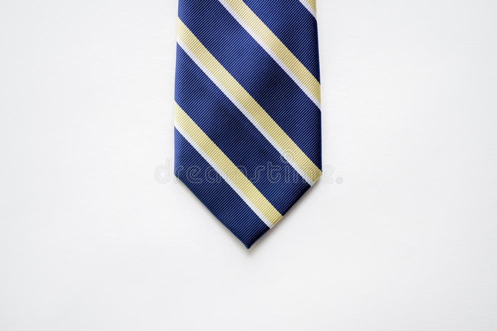 Overhead Shot of a Blue and Yellow Striped Tie on a White Surface Stock ...