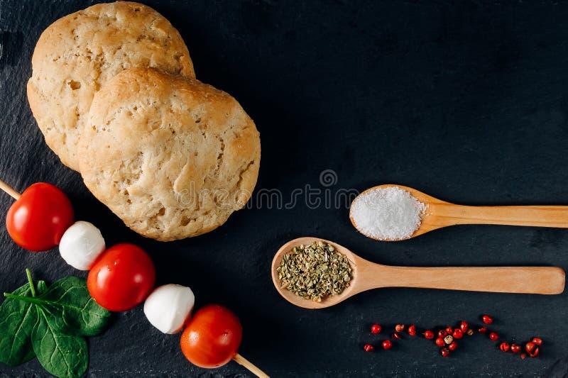 Overhead Shot of Bread, Garlic, Herbs, and Mozzarella-tomato Sticks on ...