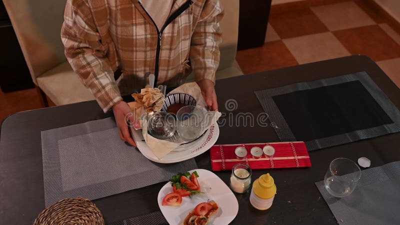Top View of a Person Enjoying a Casual Meal with Sandwich and Salad on ...