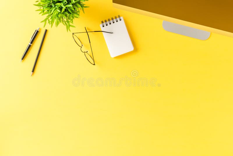 Overhead Shot of Computer and Business Accessories on Yellow Background ...