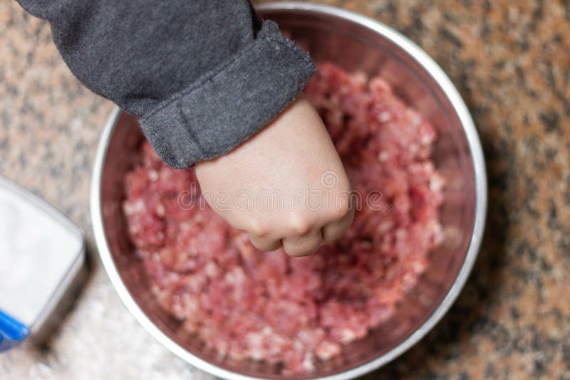 Overhead Shot of a Cook Adding Salt To Minced Meat in a Bowl Stock ...