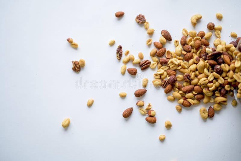Overhead Shot of Different Nuts Scattered on a White Surface Stock ...