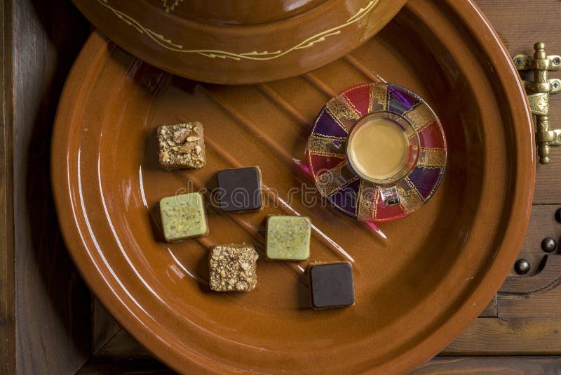 Overhead Shot of Different Types of Square-shaped Sweets with Tea on a ...