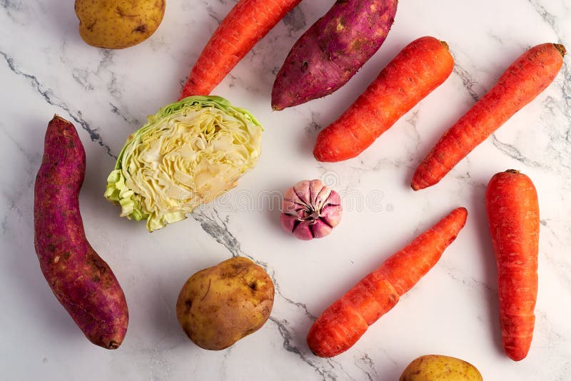 Overhead Shot of Different Vegetables on a Marble Kitchen Table Surface ...