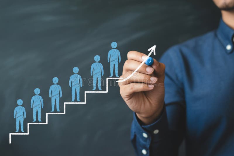 People Putting Together a World Map Jigsaw Puzzle on a White Table with ...