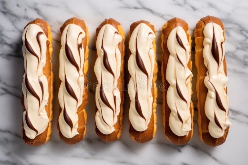 Overhead Shot of Eclairs Filled with Cream on a Marble Slab Stock ...