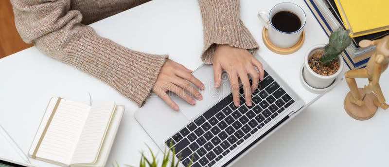Female Typing Laptop with Notebook, Books and Decorations on White ...