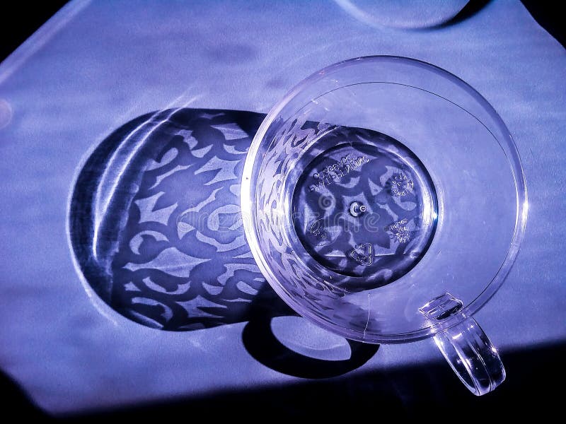 Overhead Shot of a Glass Cup with Floral Patterns and Its Shadow Stock ...