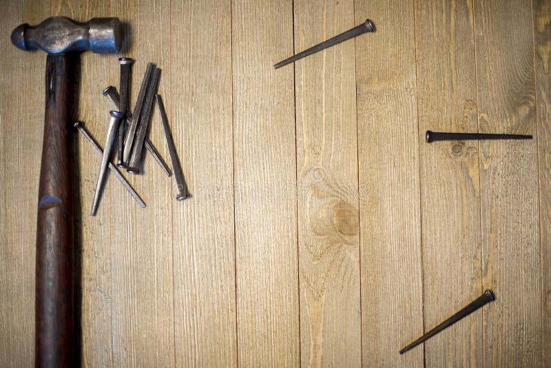 Overhead Shot of a Hammer Near Nails on a Wooden Surface Stock Photo ...