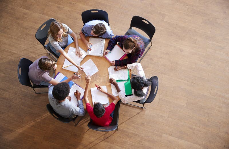 Overhead Shot of High School Pupils in Group Study Around Tables Stock ...