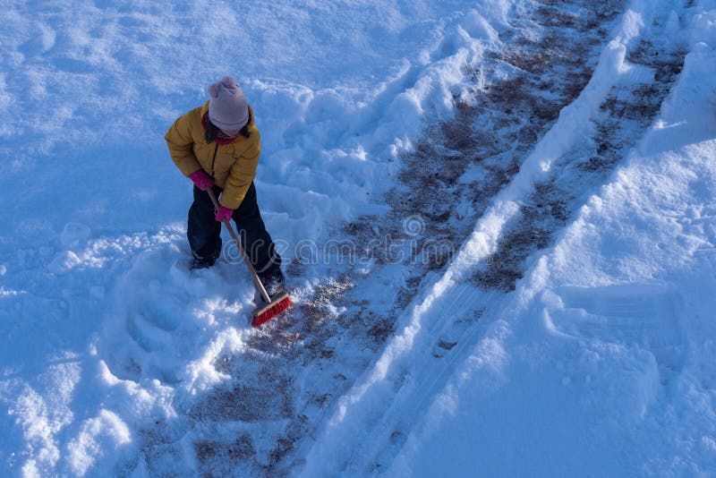 Overhead Shot of a Kid Making a Path in the Snow Stock Image - Image of ...