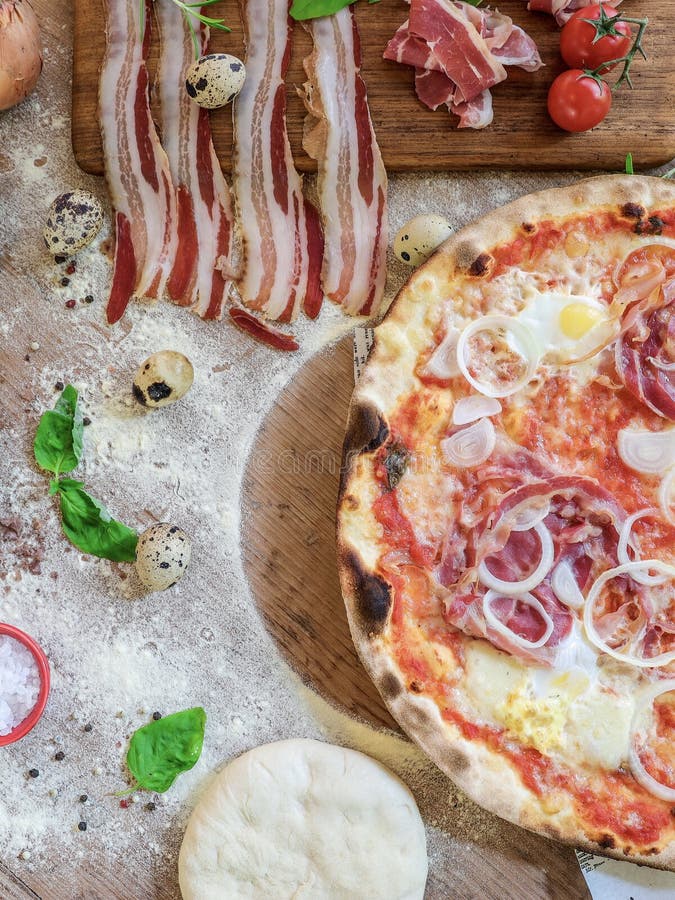 Overhead Shot of a Kitchen Table with Beacon and Tomatoes Being Added ...