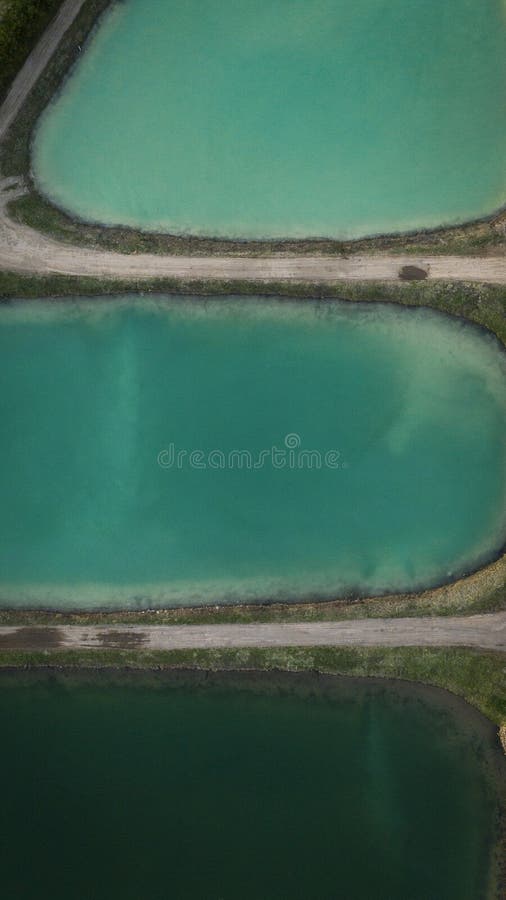 Overhead Shot of Lakes Separated by Narrow Roads on Land Stock Image ...