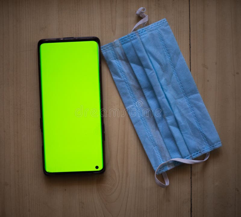 Overhead Shot of a Mask and a Phone Screen Stock Photo - Image of mask ...