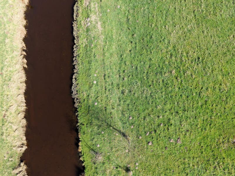 Overhead Shot of a River Near the Grassy Field Stock Image - Image of ...