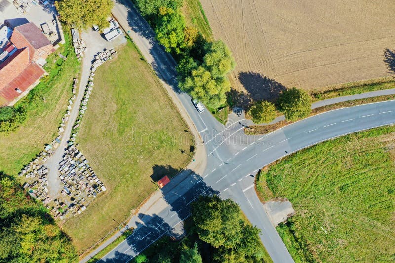Overhead Shot of a Road Next To a Field and a Valley Stock Image ...