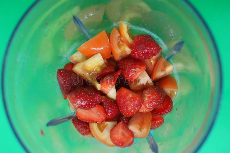 Overhead Shot of Sliced Strawberries and Tomato in a Blender Stock ...