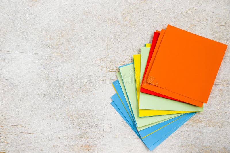 Overhead Shot of a Stack of Colorful Notepad on a White Surface with ...
