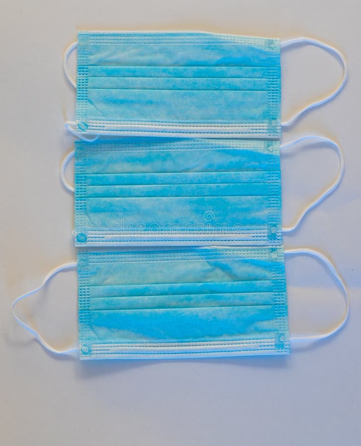 Overhead Shot of Three Light Blue Medical Masks Placed Next To Each ...
