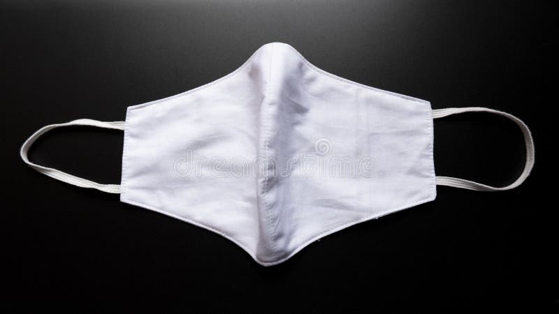 Overhead Shot of a White Face Mask on a Black Surface Stock Photo ...