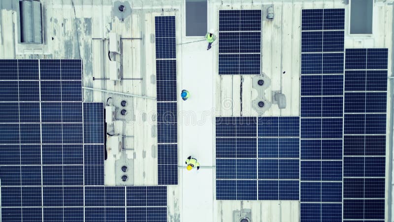 Overhead, Solar and Construction Worker Team on the Roof of a Building ...