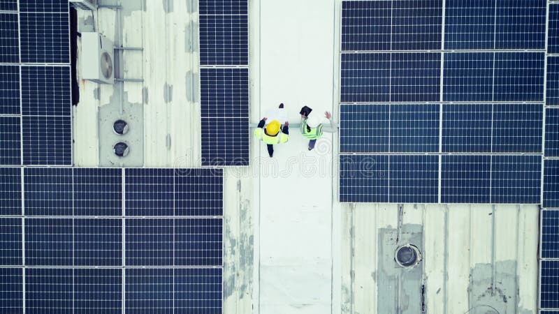 Overhead, Solar Energy and a Construction Worker Team on the Roof of a ...