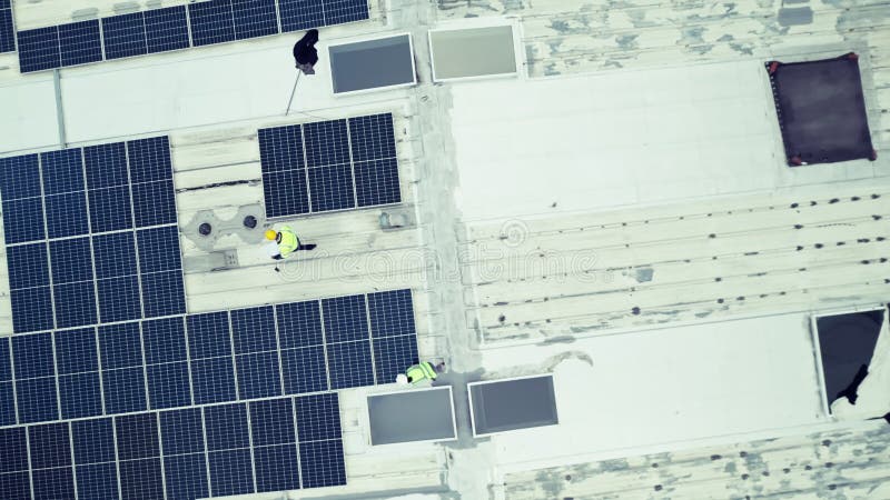 Overhead, Solar Power and a Construction Worker Team on the Roof of a ...