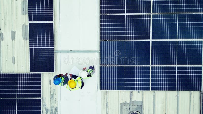 Overhead, Solar Power and a Construction Worker Team on the Roof of a ...