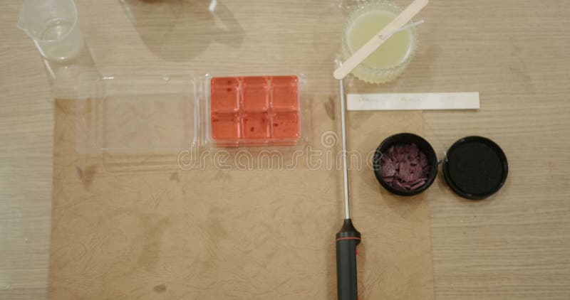 An Overhead of a Table in a Workshop Where a Class on Making Scented ...