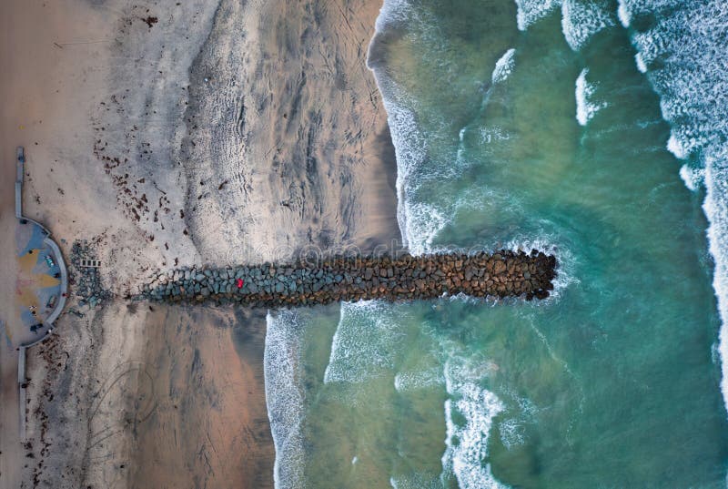 Overhead Top-down Drone View of Jetty with Waves Breaking Stock Photo ...